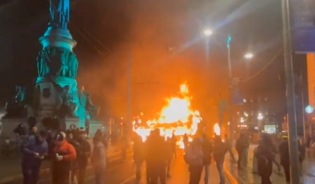 Woman due in court over bus arson during Dublin riots as gardaí make nine more arrests ...